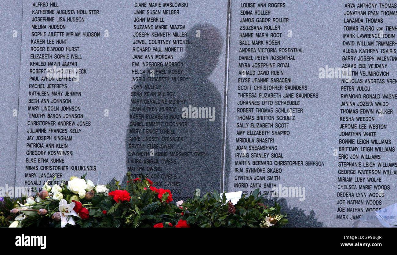 The shadow of a member of the public looking at the main memorial stone ...