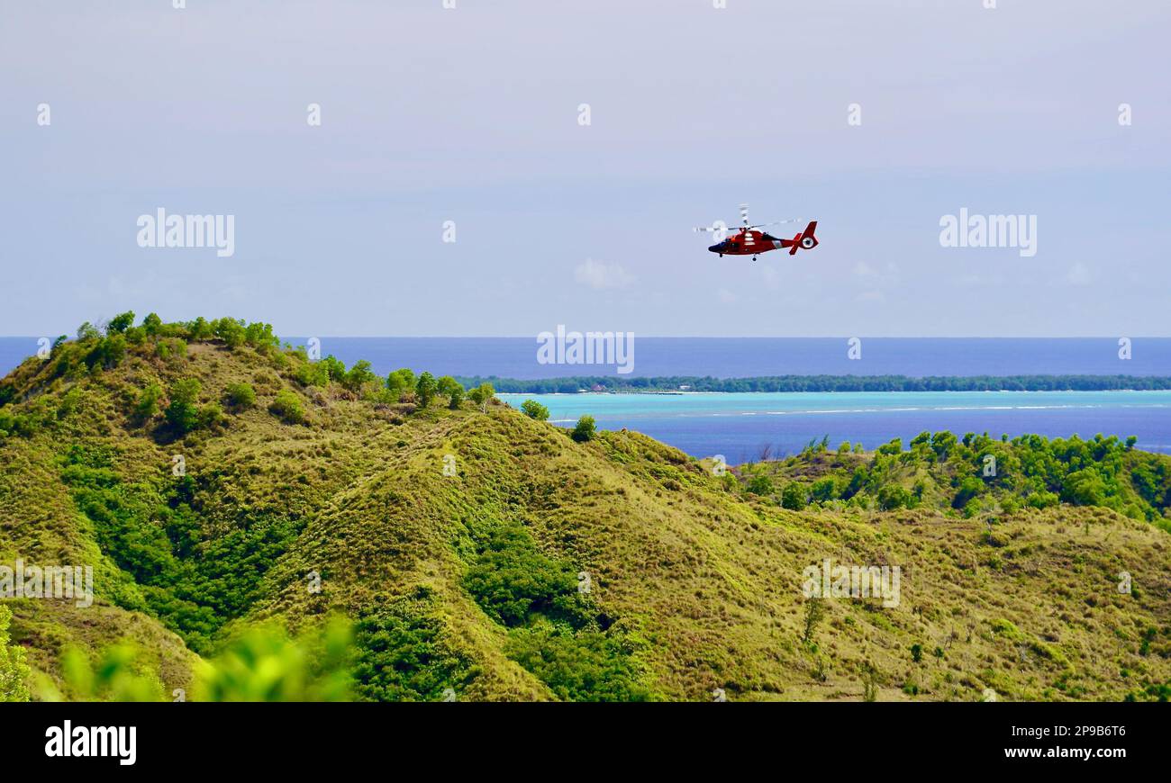 An MH-65 Dolphin helicopter crew deployed to Guam from U.S. Coast Guard ...