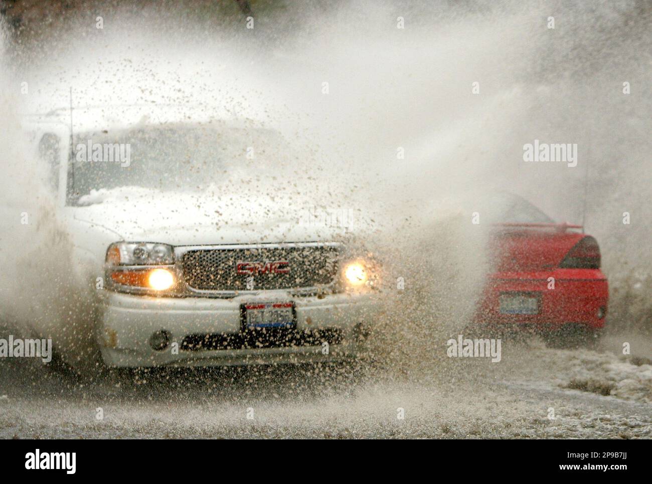 Vehicles plow through standing water on Nottingham Road in Cleveland ...