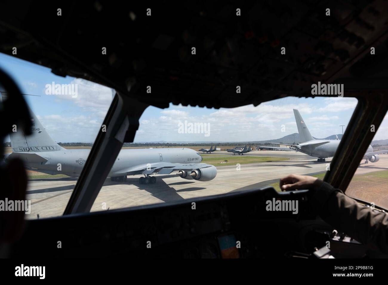 From front to back, two U.S. Air Force F-15C aircraft assigned to ...