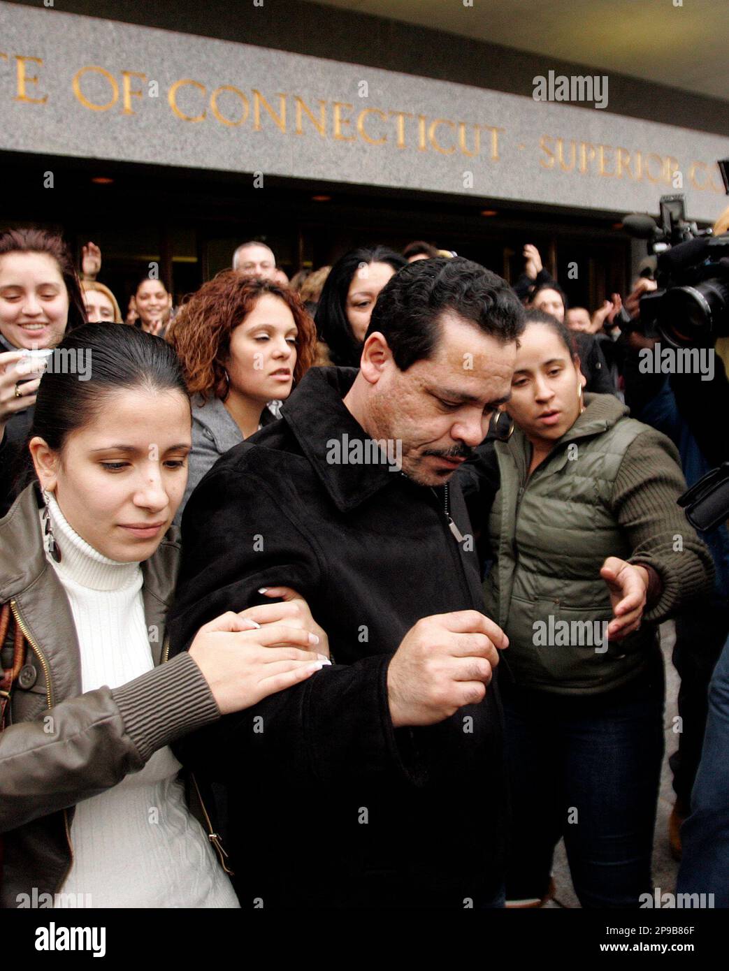 Miguel Roman leaves Superior Court in Hartford, Conn., Friday, Dec. 19 ...
