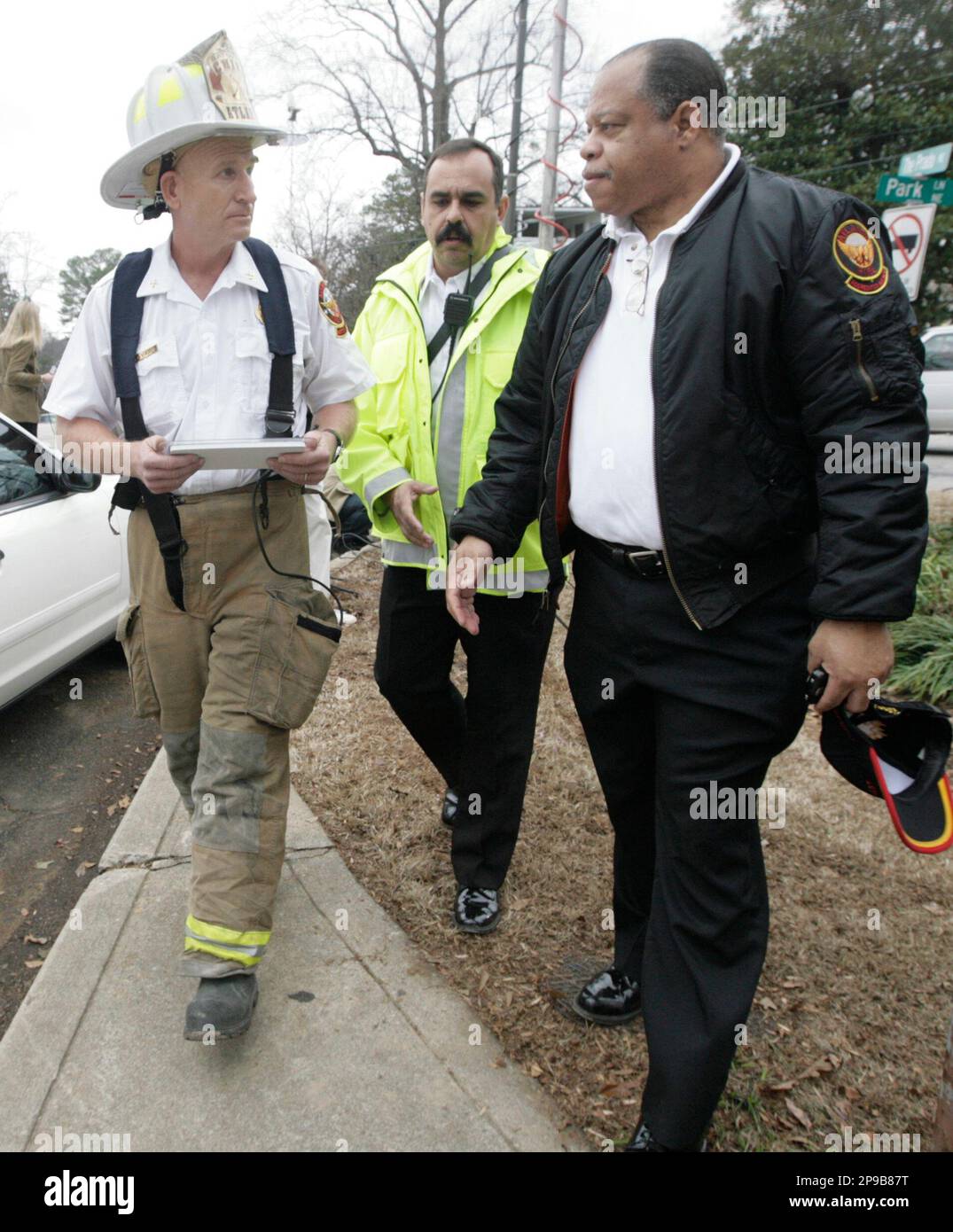 Atlanta Fire Rescue battalion chief Ken Byers, left, chaplain Thomas ...