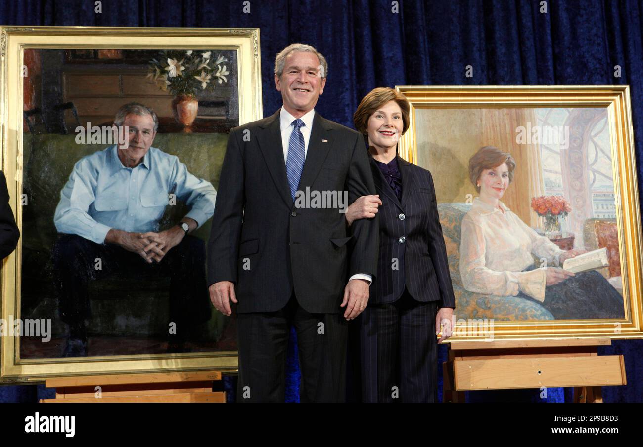 President George W. Bush and first lady Laura Bush pose with their ...