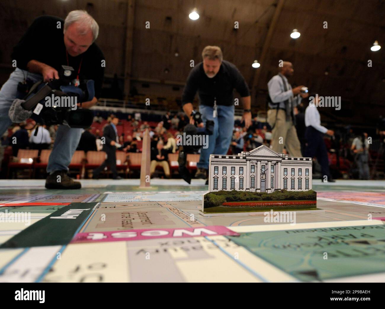 A cut-out representing the White House marks the 40-by-40 foot map used ...