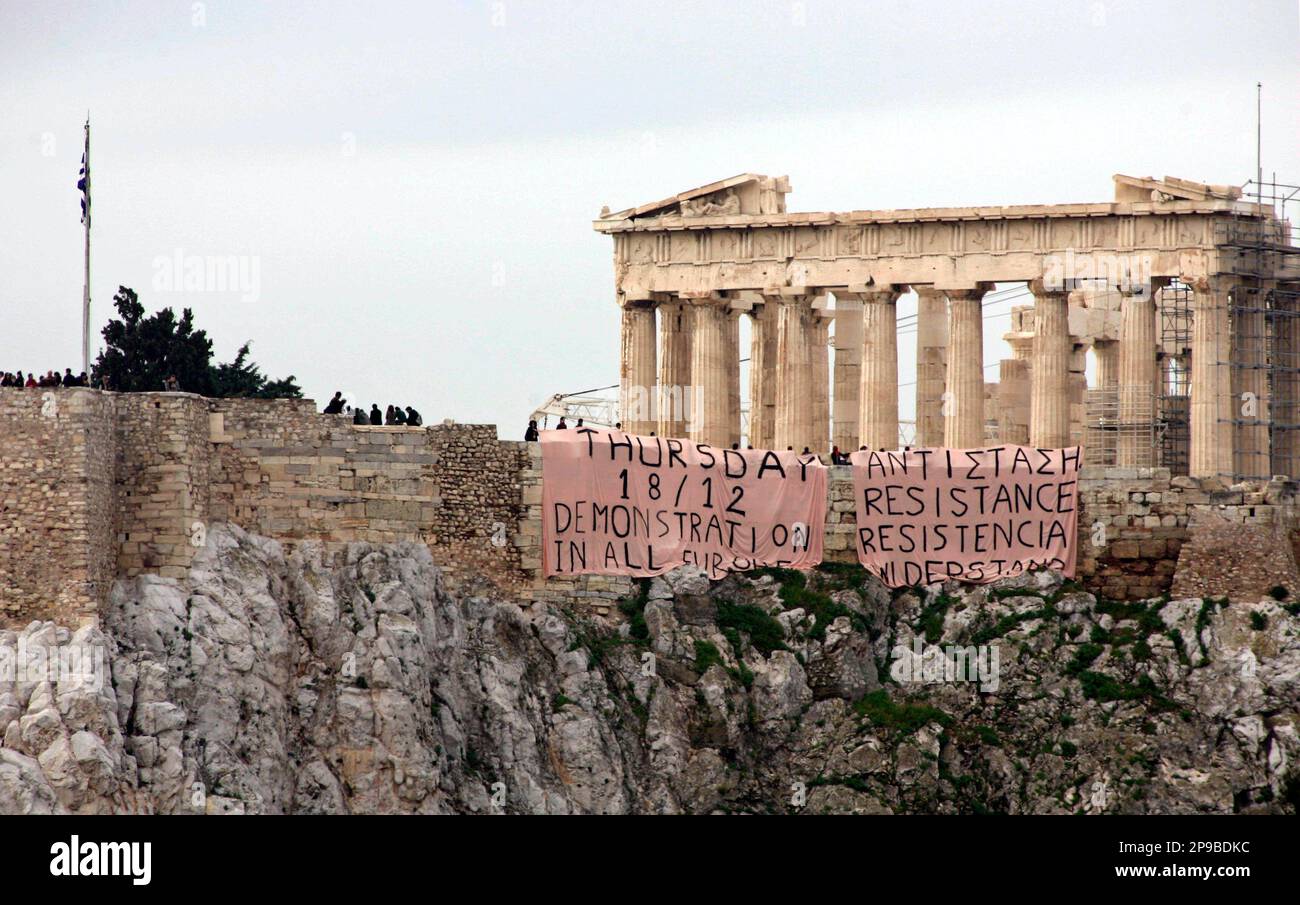 Backdropped by the ancient Parthenon, protesters can be seen after they ...