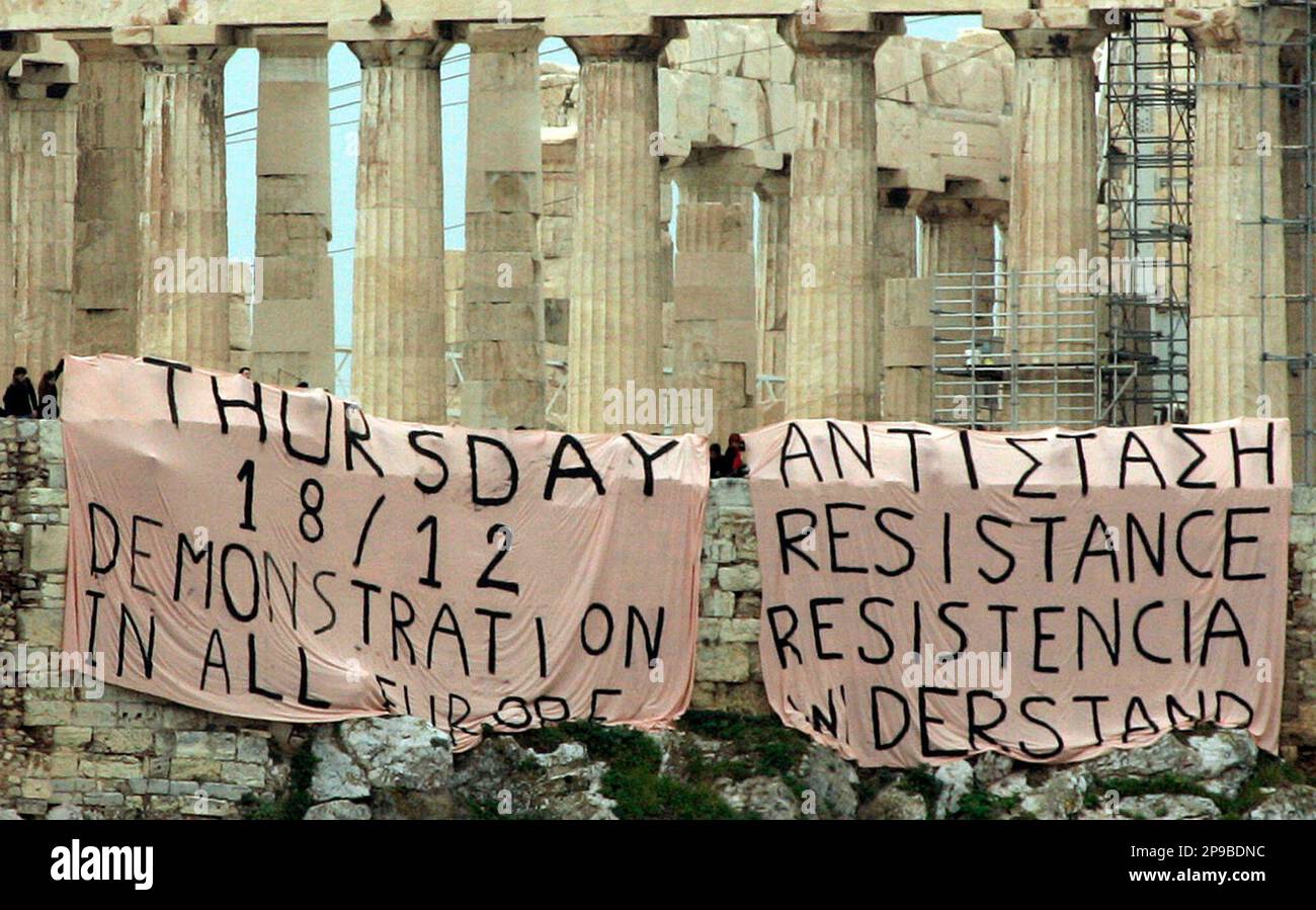 Backdropped by the ancient Parthenon, protesters can be seen after they ...