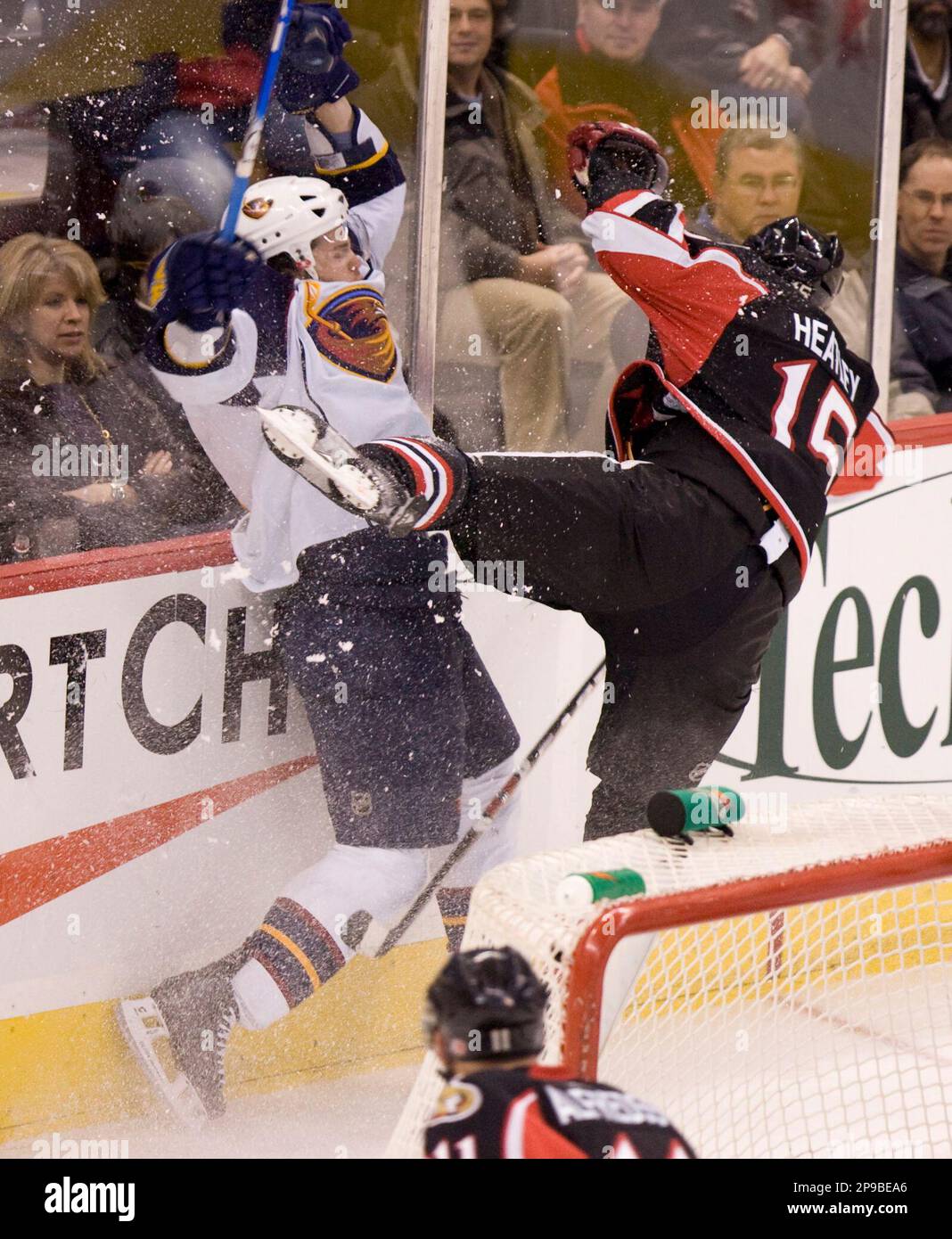 Atlanta Thrashers' Garnet Exelby, left, and Ottawa Senators' Dany ...