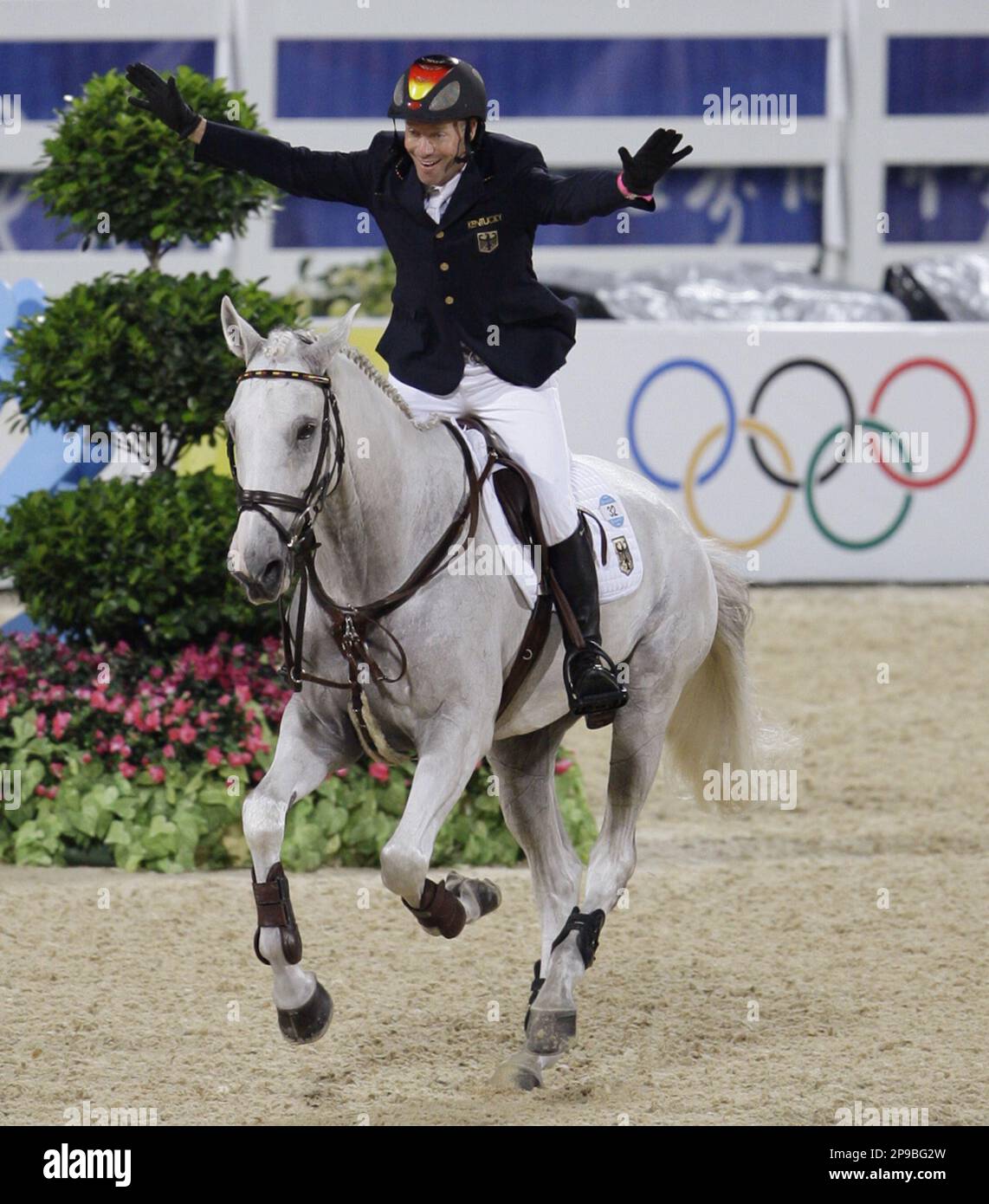 ** FILE ** Gold medalist, German rider Hinrich Romeiker with his horse ...