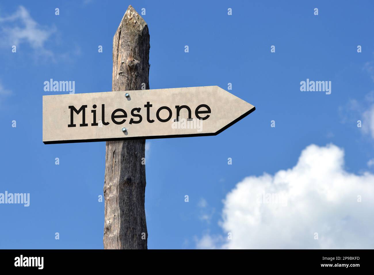 Milestone - wooden signpost with one arrow, sky with clouds Stock Photo ...