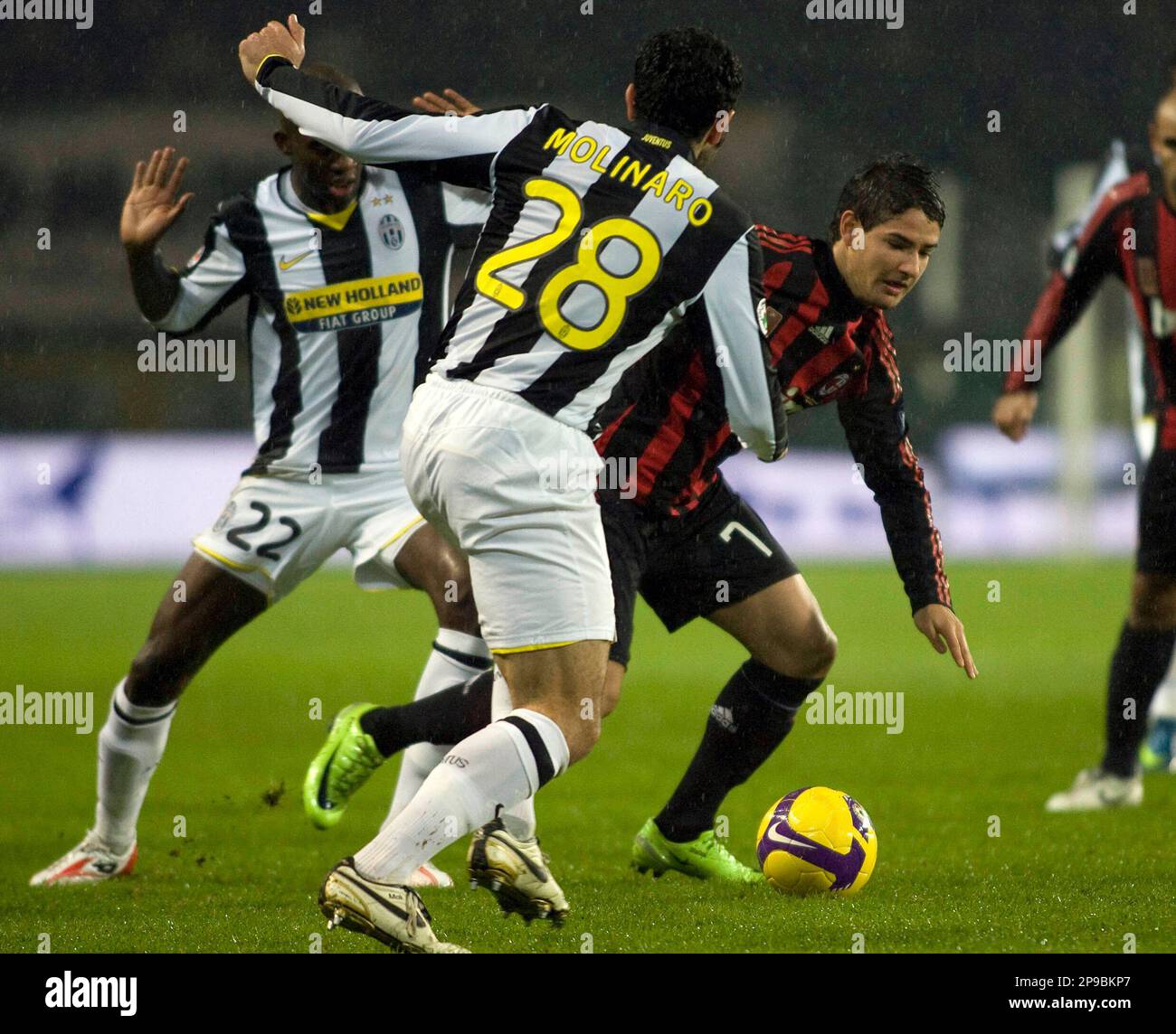 AC Milan forward Alexandre Pato, of Brazil, right, is tackled by ...