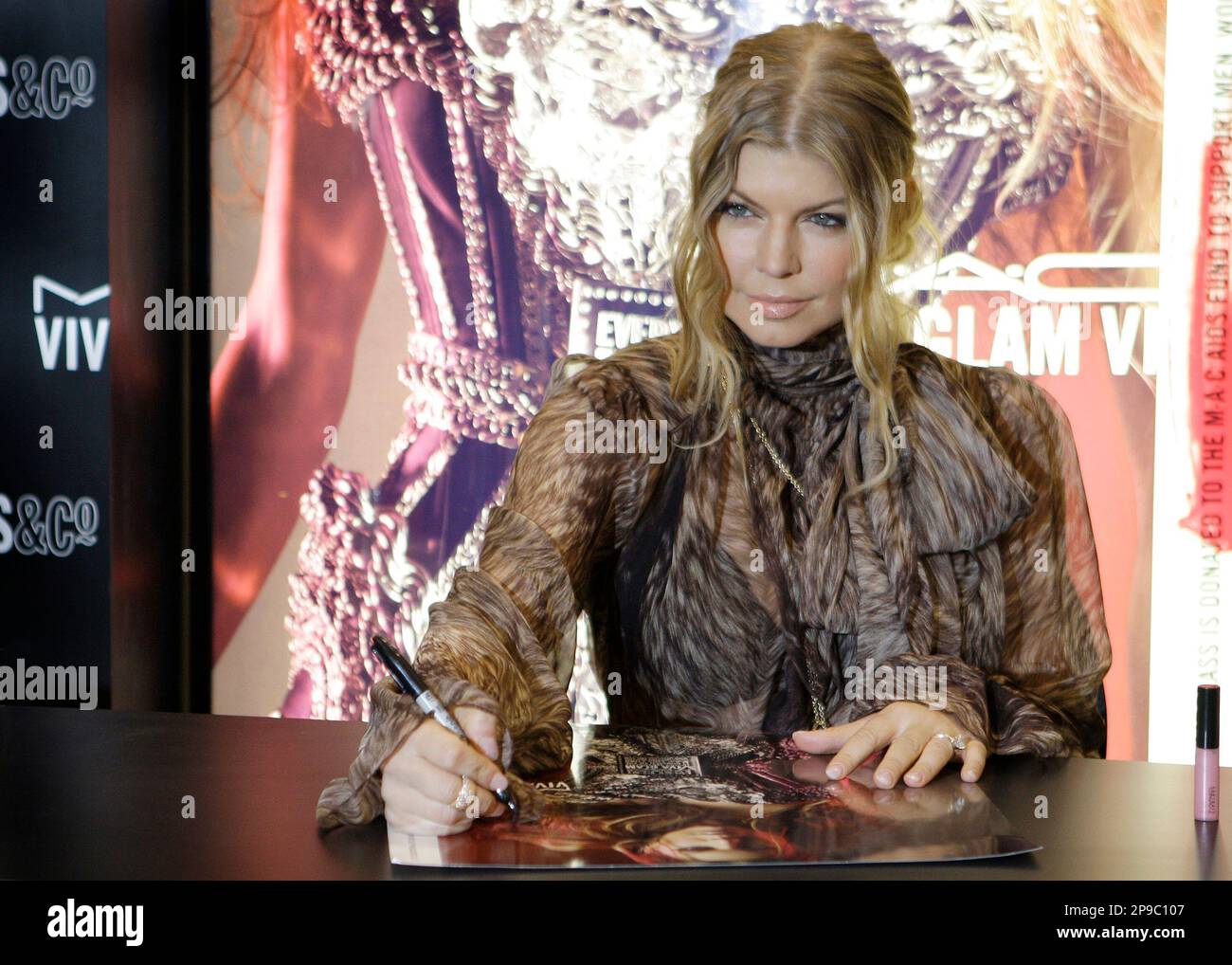 US singer Fergie appears in a central London store to launch a ...