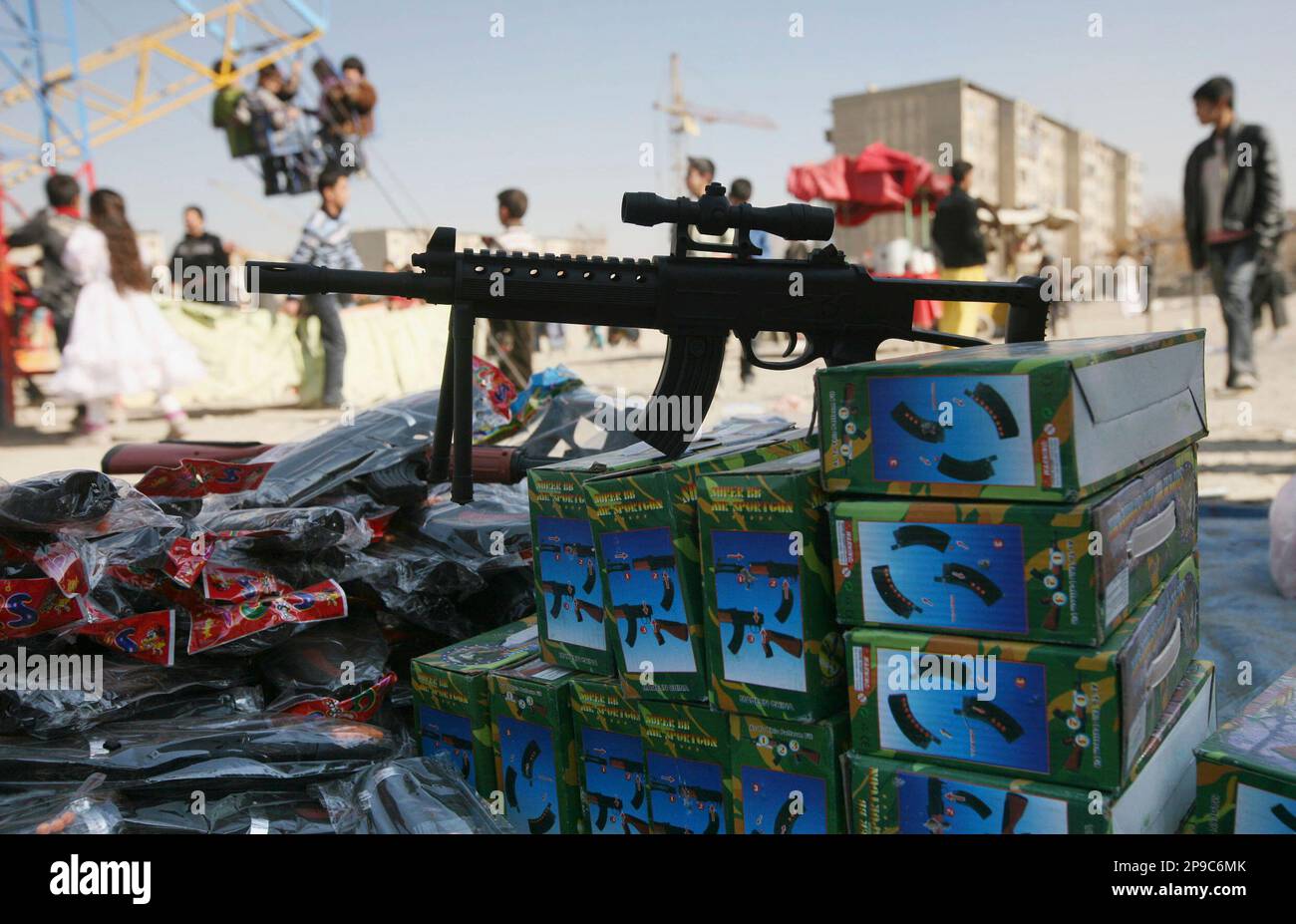 A toy guns are displayed for sale on the second day of the Eid al-Adha ...
