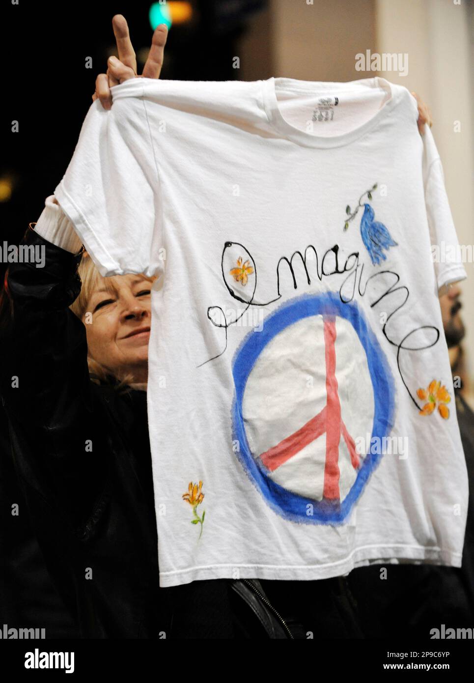 Carolyn Good of Los Angeles holds up a T-shirt she made for a public ...