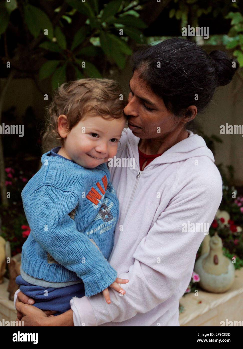 Indian nanny Sandra Samuel holds Moshe Holtzberg, 2, orphan of Rabbi ...