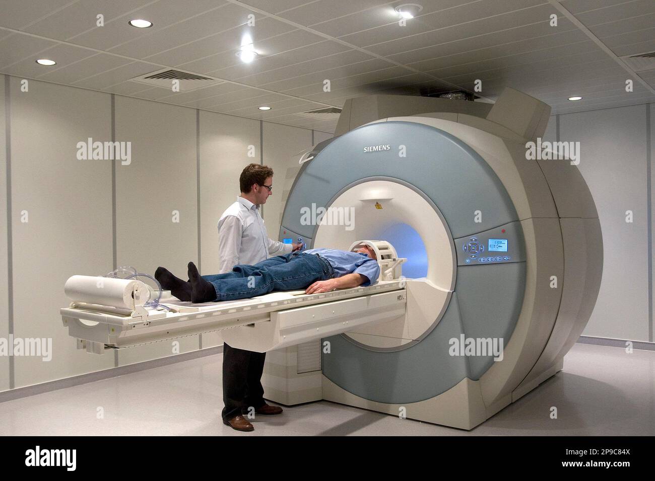 Sebastian Rieger, physicist MRI, makes a demonstration of new 3 Tesla ...