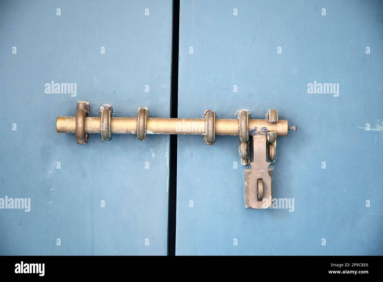 Lock bolt on blue metal gate, element for secure property lock ...