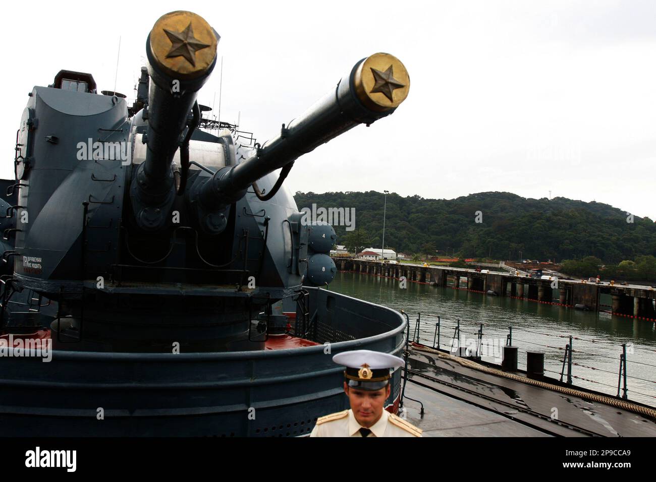 A Russian Navy member walks on deck at the Russian warship Admiral ...