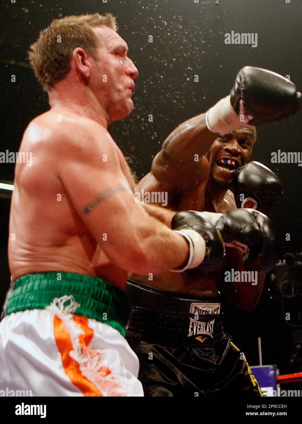 Former British Olympic gold medalist Audley Harrison, right, throws a ...