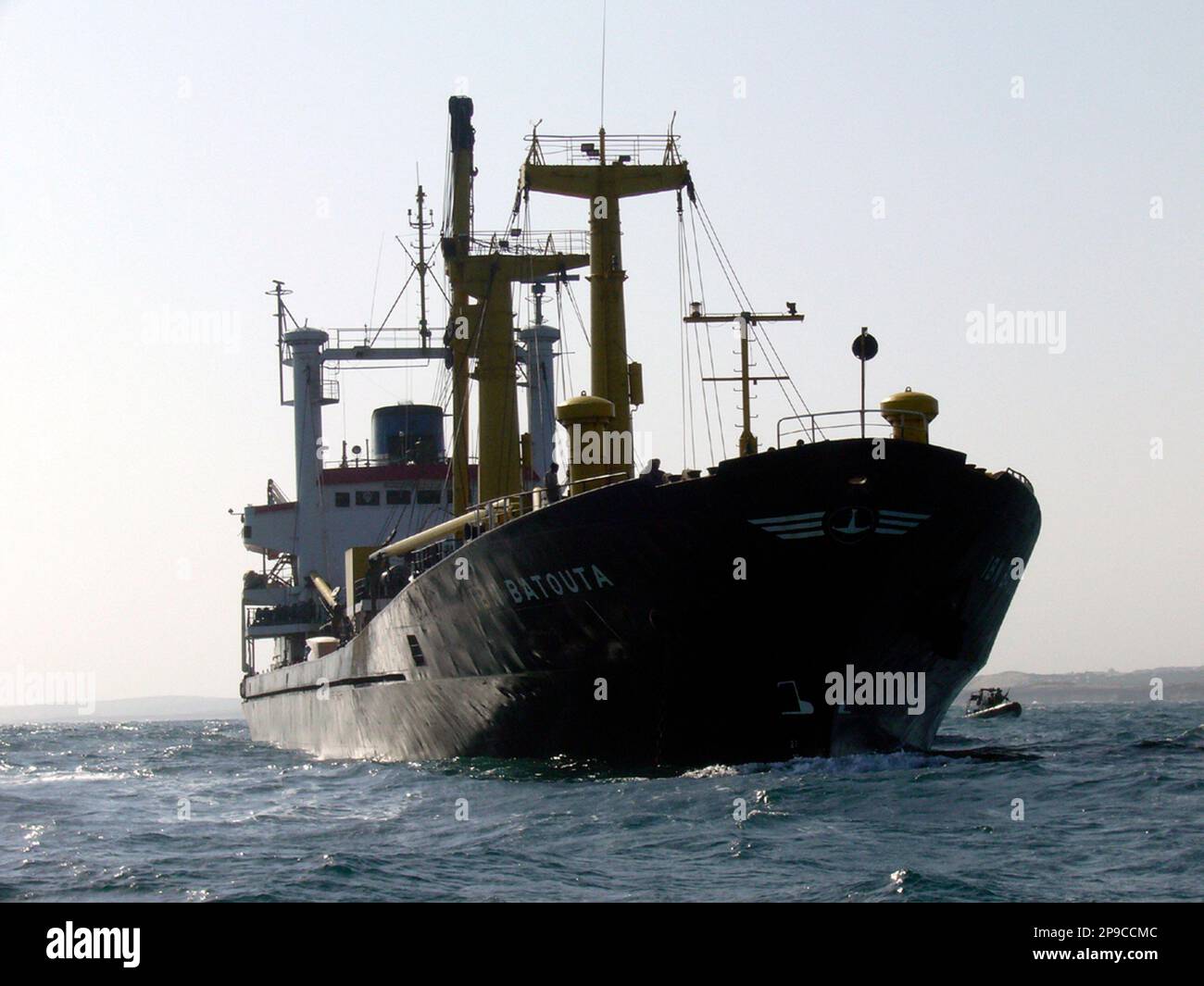 A speed boat of Dutch special forces, right, guards the MV Ibn Batouta ...