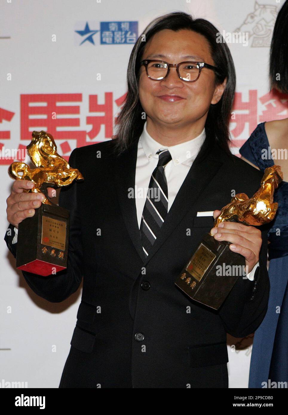 Hong Kong director Peter Ho-Sun Chan, displays his awards for Best ...