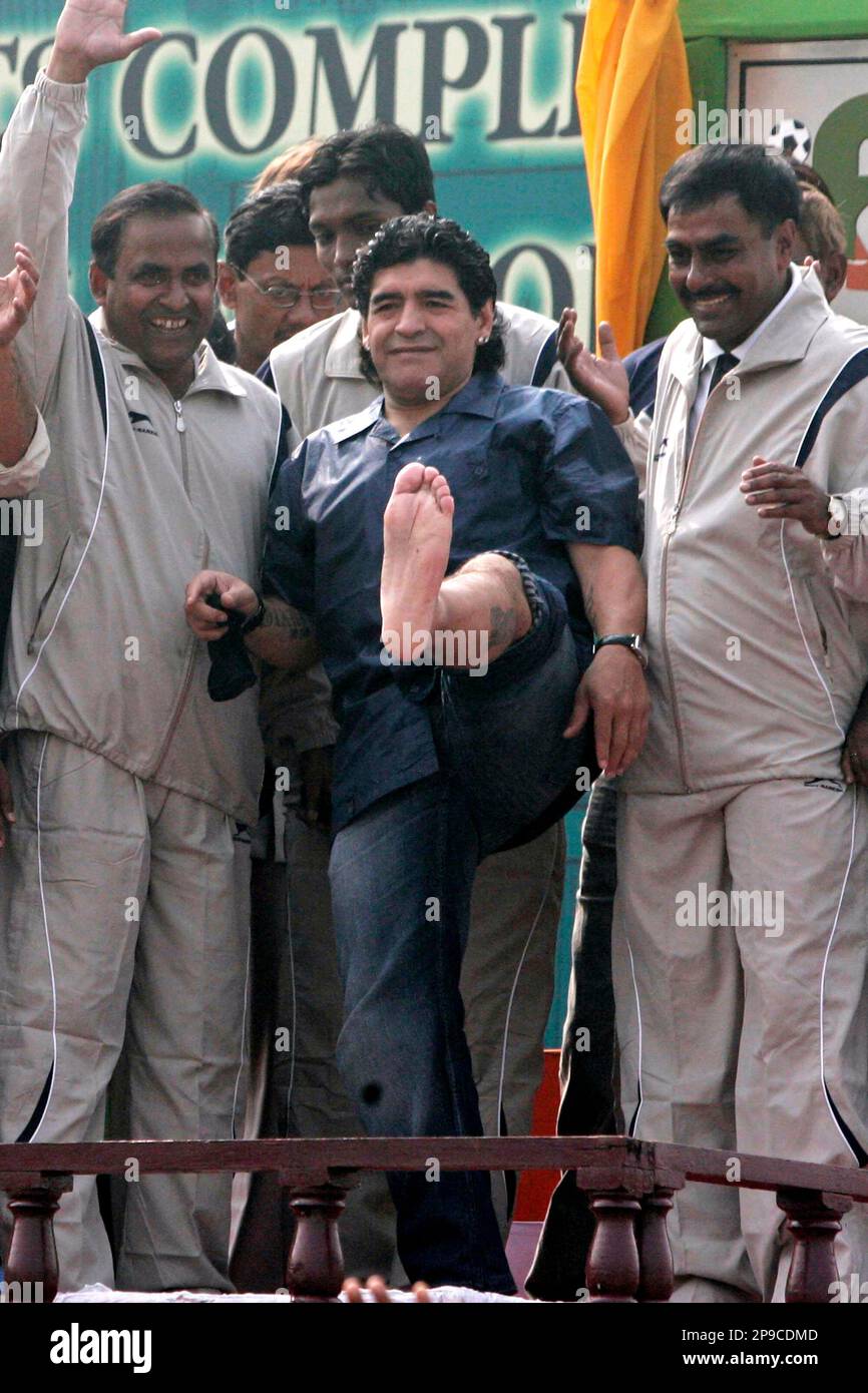 Argentina's national soccer team coach Diego Maradona shows his left ...