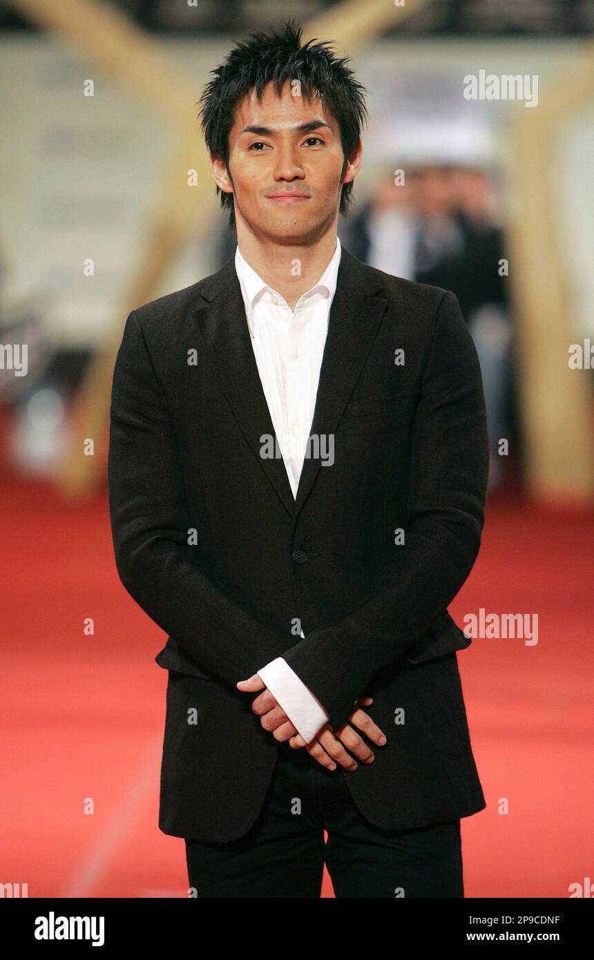 Japanese singer Kousuke Atari smiles as he arrives at the 45th Golden ...