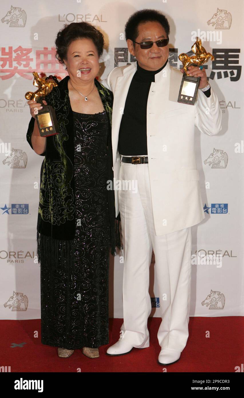 Taiwanese actress Mei Fang and Taiwanese actor Ma Ru-long hold their ...