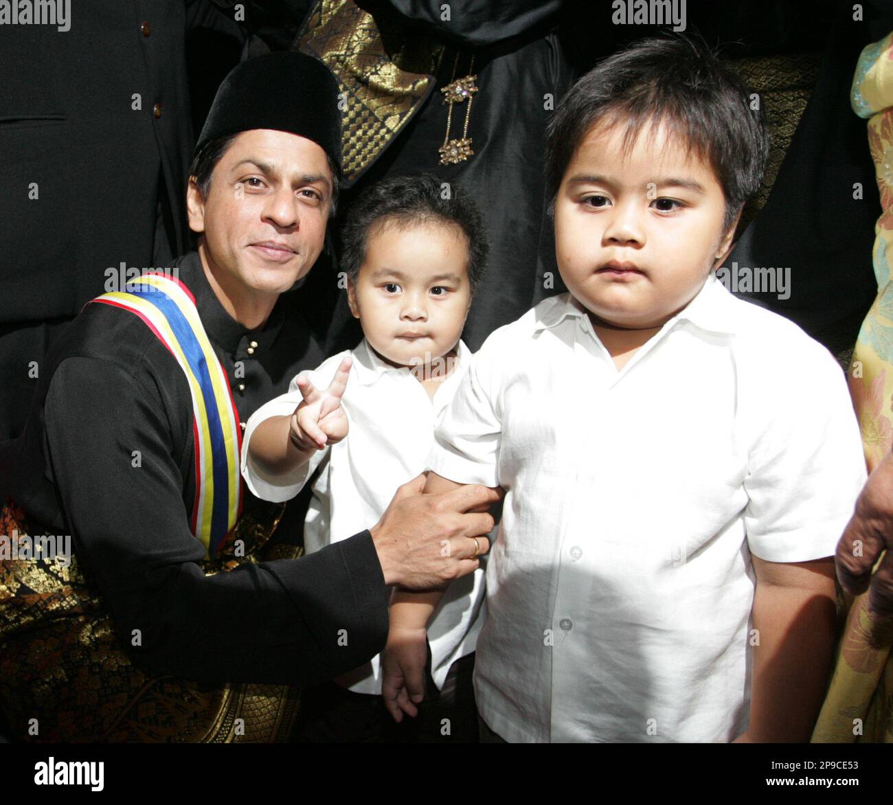 Bollywood actor Shah Rukh Khan in a traditional official black Malay ...