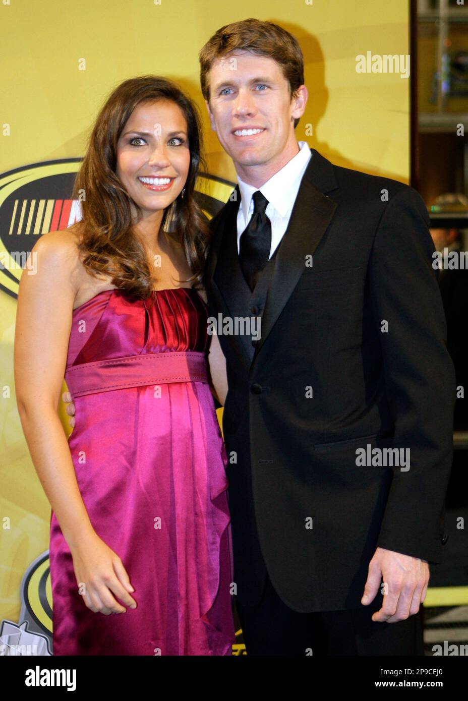 NASCAR driver Carl Edwards, right, and Kate Downey pose for a photograph before the start of the ...