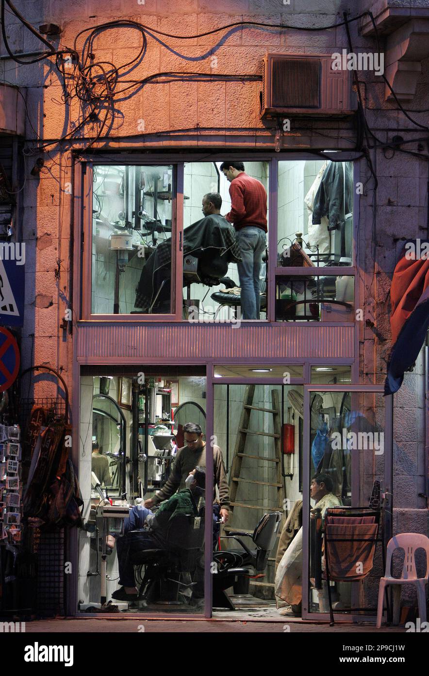 Barbers at a two-storey shop in downtown Amman, Jordan on Thursday Dec ...