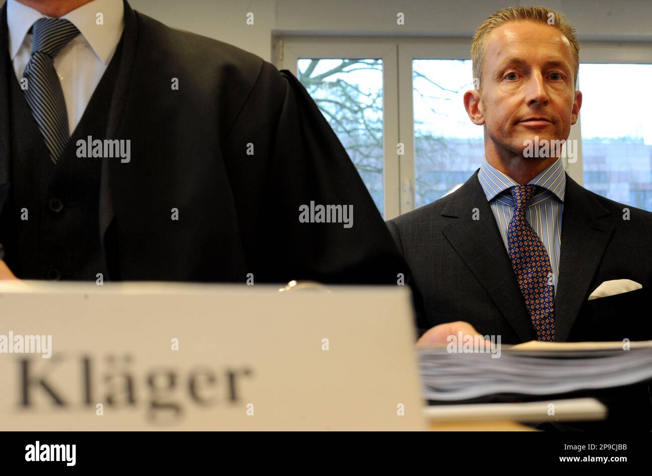 Friedrich zu Solms-Baruth, right, waits for the beginning of a court ...