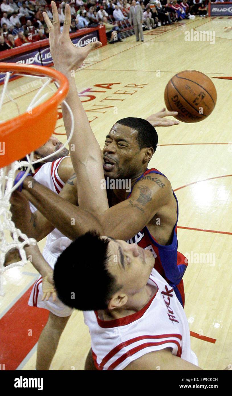 Los Angeles Clippers' Marcus Camby, right, loses the ball as he hits ...