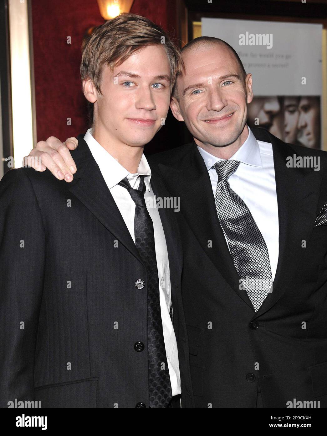 Actors David Kross, left, and Ralph Fiennes pose together at the ...