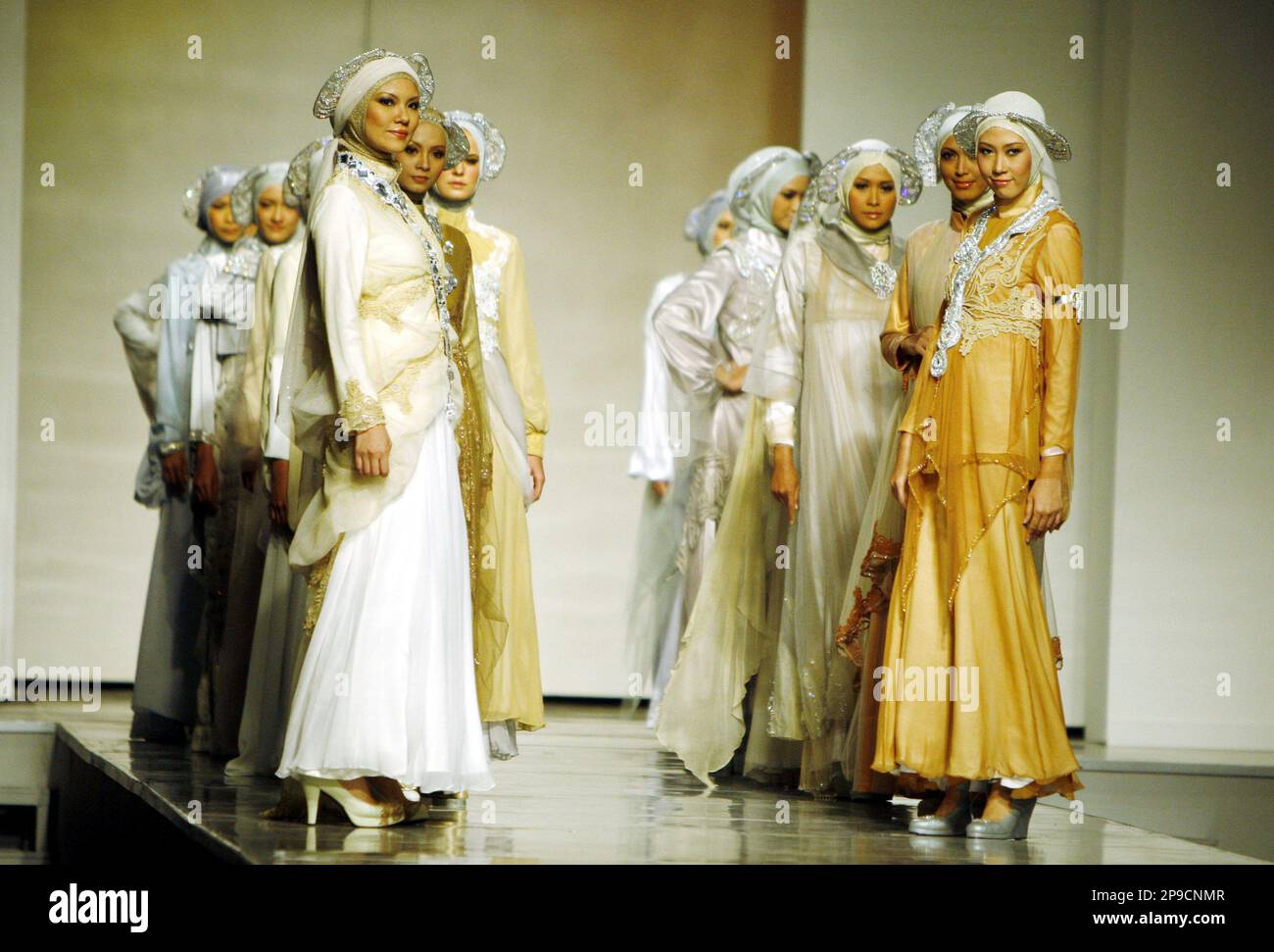 Indonesian models pose, wearing creations by Indonesian fashion ...