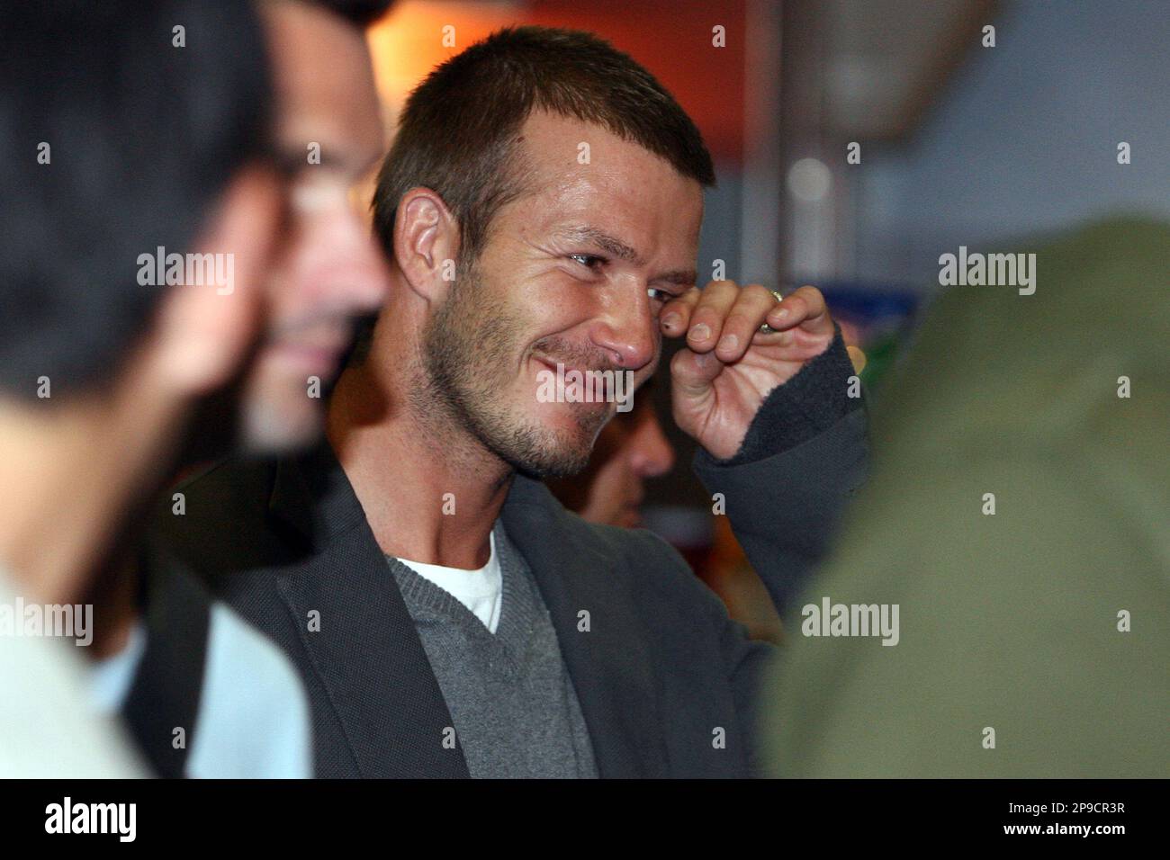 L A Galaxy soccer player David Beckham smiles to fans on his arrival at ...