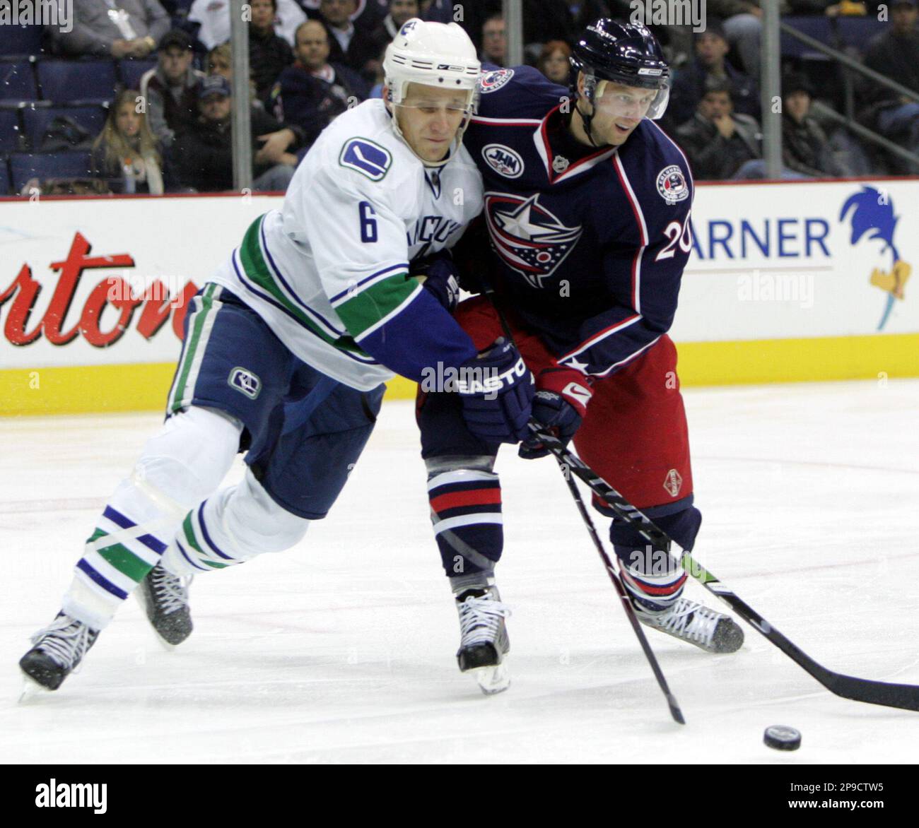 Vancouver Canucks' Sami Salo of Finland, left, and Columbus Blue ...