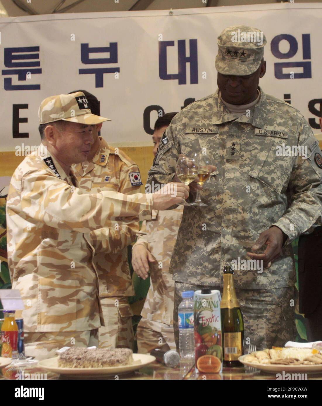 South Korean Vice Admiral Kim Choong-ryon toasts with the US Army Lt ...