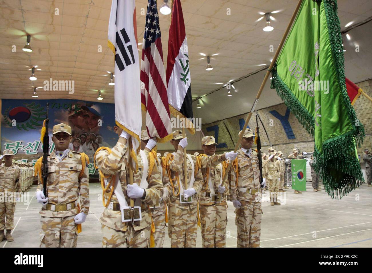 South Korean soldiers carry flags during a ceremony to mark the end of ...
