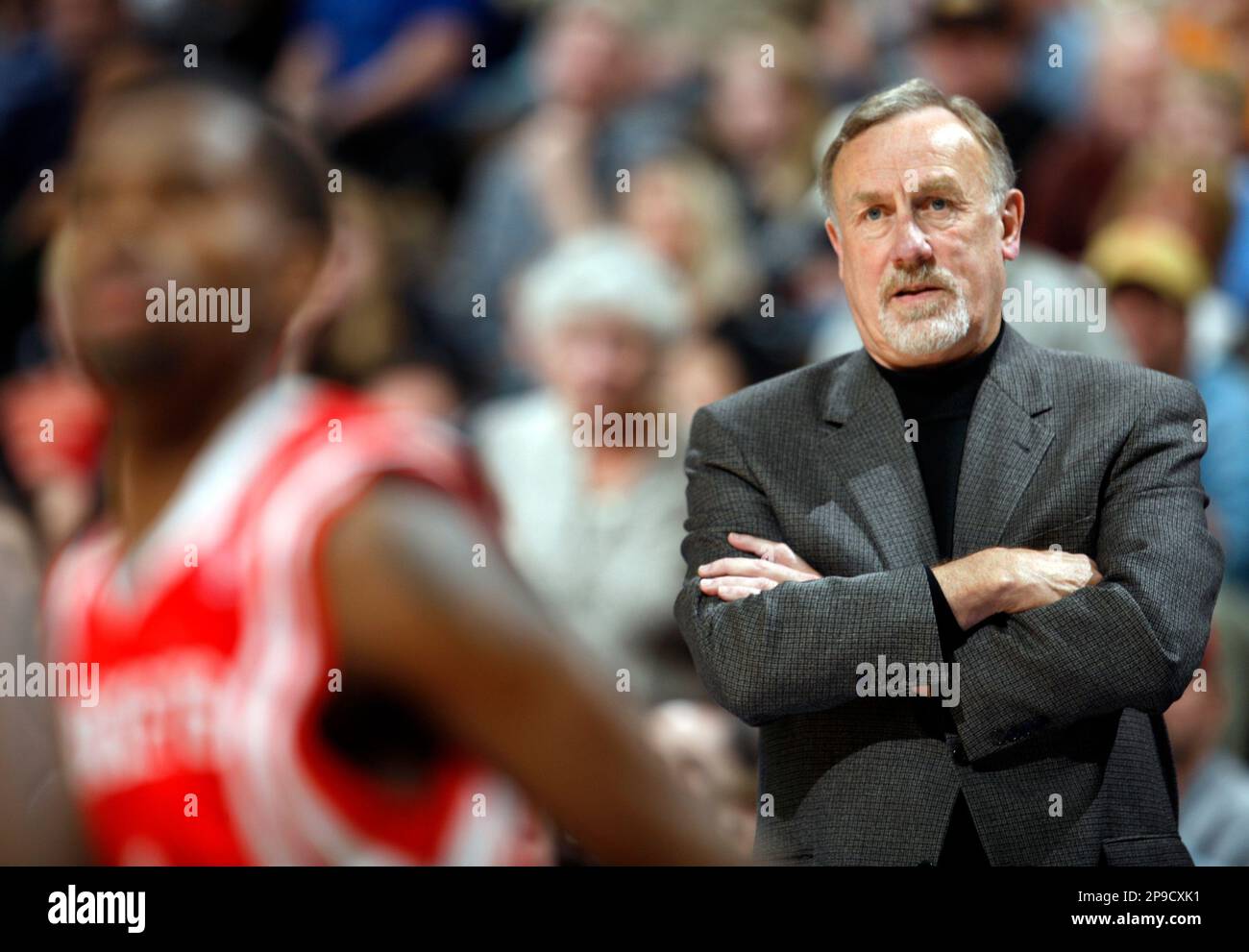 Houston Rockets coach Rick Adelman, back, looks at guard Aaron Brooks ...