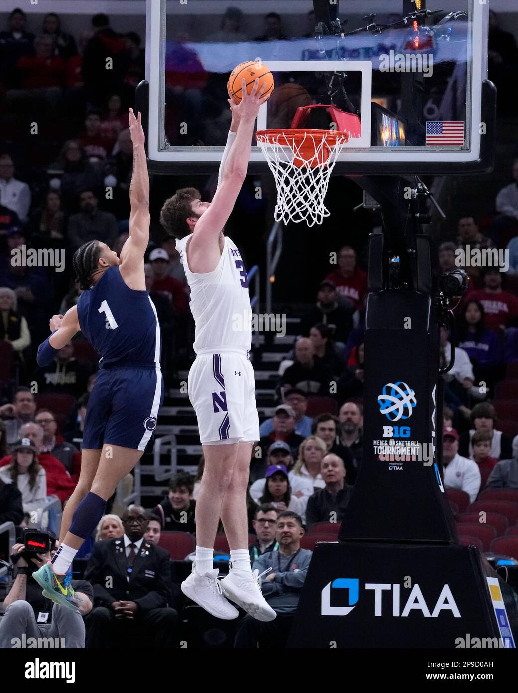 Northwestern's Matthew Nicholson dunks as Penn State's Seth Lundy ...
