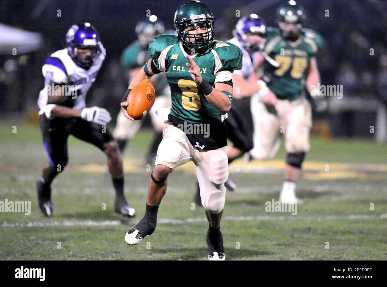Cal Poly Mustang Jonathan Dally runs with the ball against Weber State ...