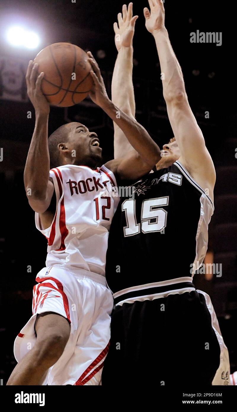 Houston Rockets' Rafer Alston (12) goes up against San Antonio Spurs ...