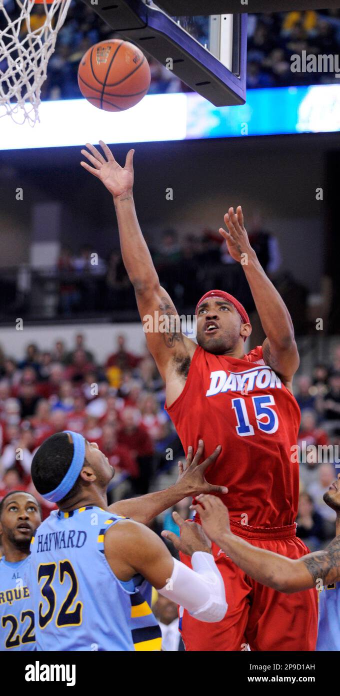 Dayton's Charles Little right, goes up for a shot against Marquette's ...