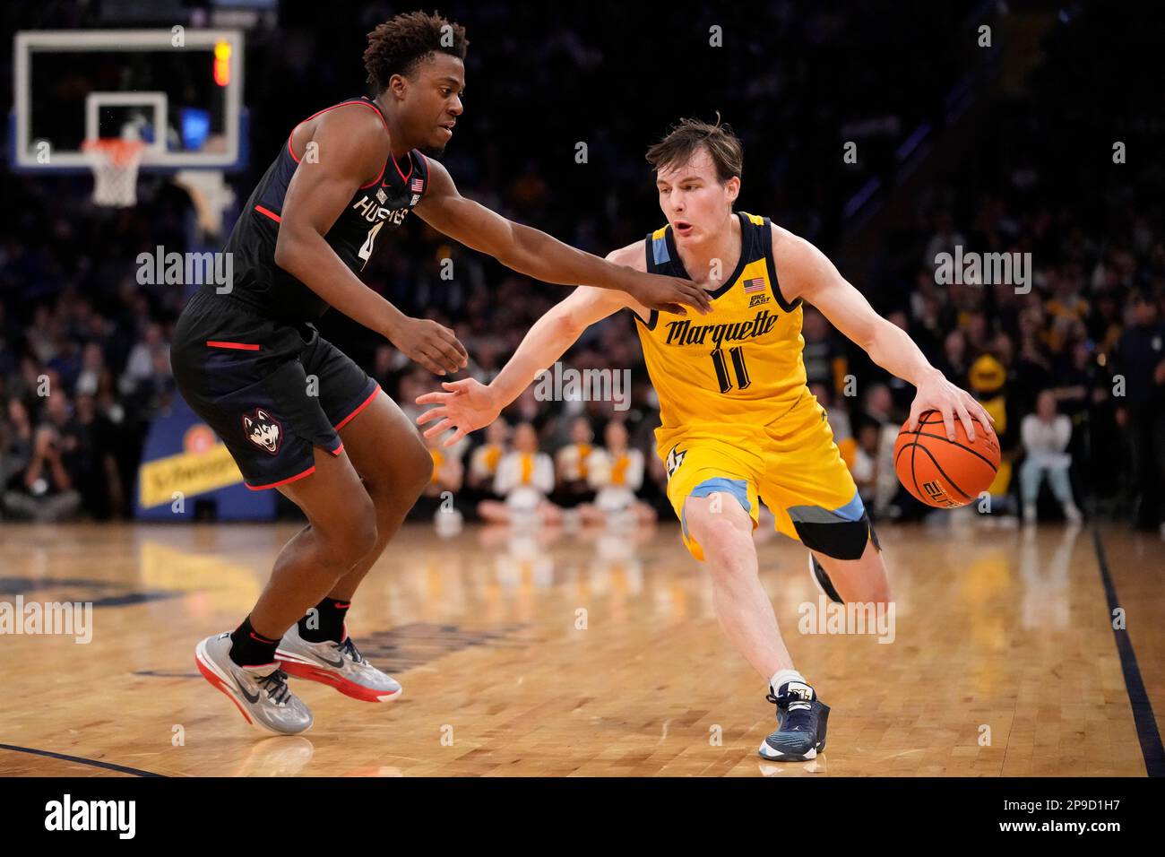 Marquette's Tyler Kolek (11) drives against Connecticut's Nahiem ...