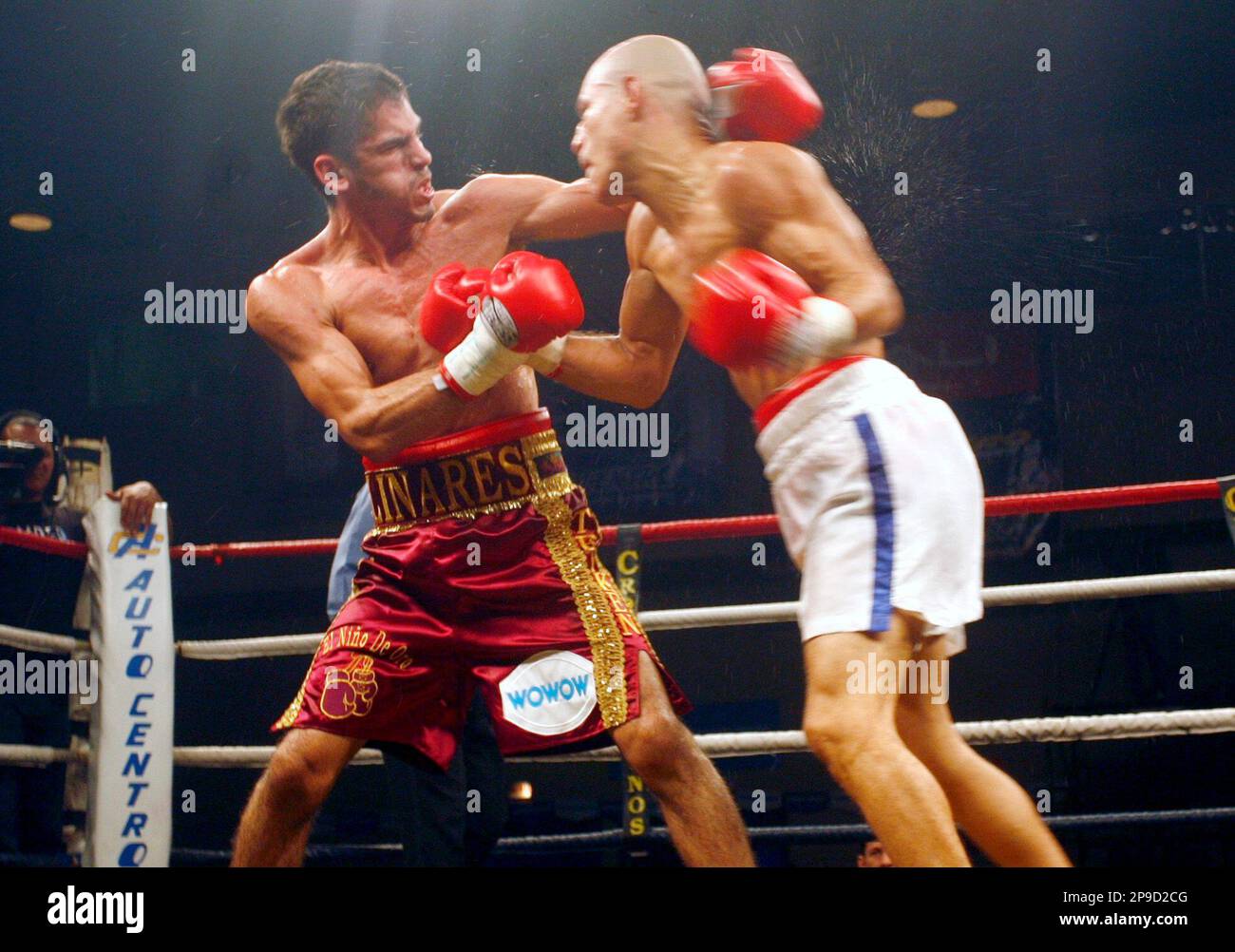 Venezuela's boxer Jorge Linares, left, exchanges punches with Panama's ...