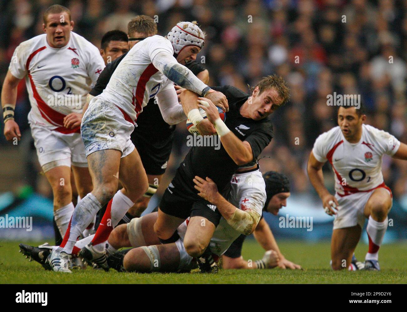 England's James Haskell, left, challenges New Zealand's Jimmy Cowan ...