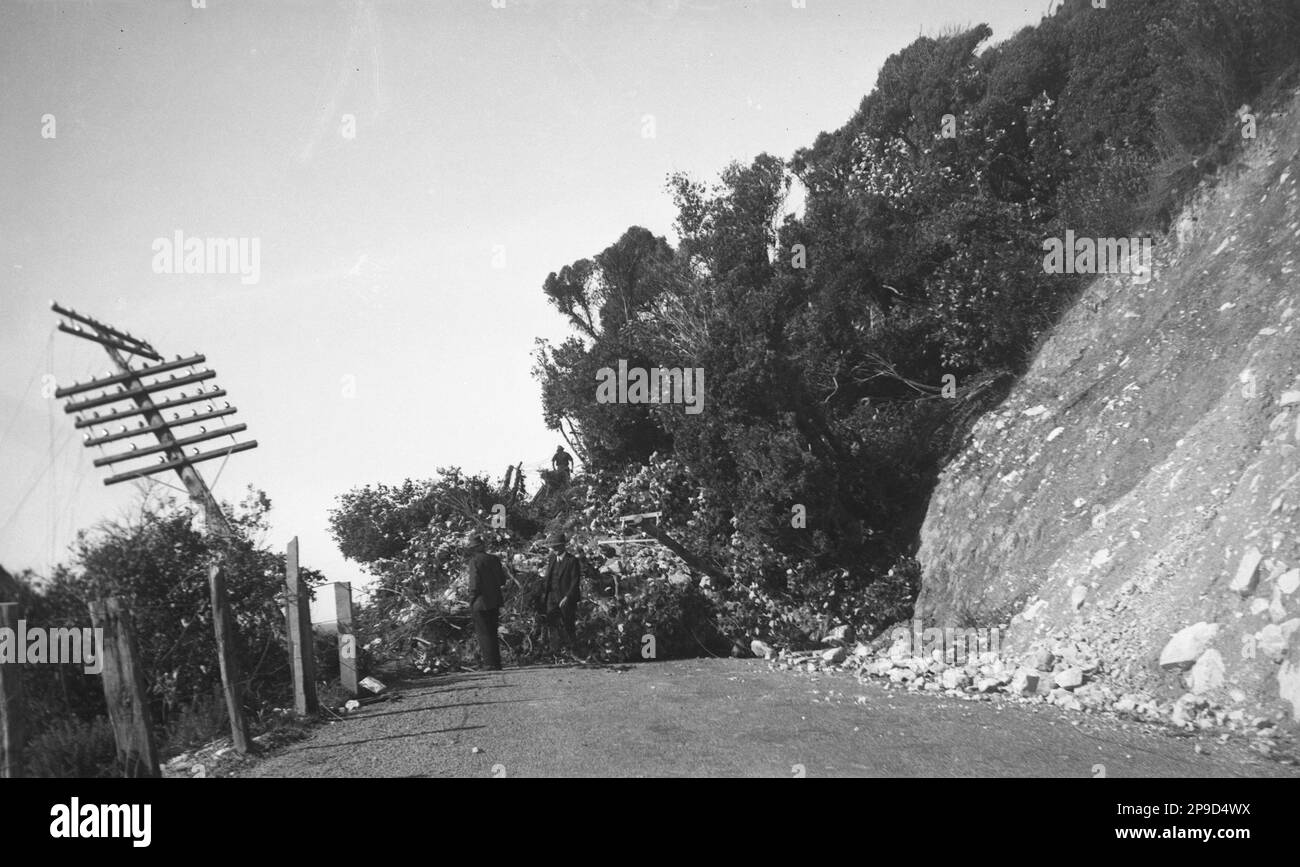 Clearing a landslip on the road at Omoto, near Greymouth, Westland, New ...