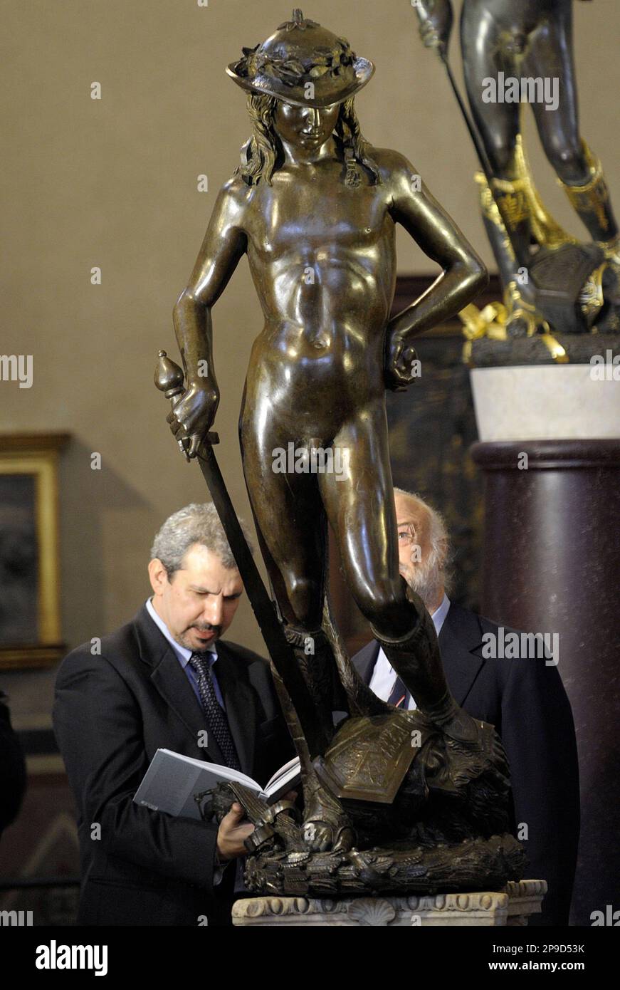 Visitors look at Donatello's 15th-century bronze statue of David during ...