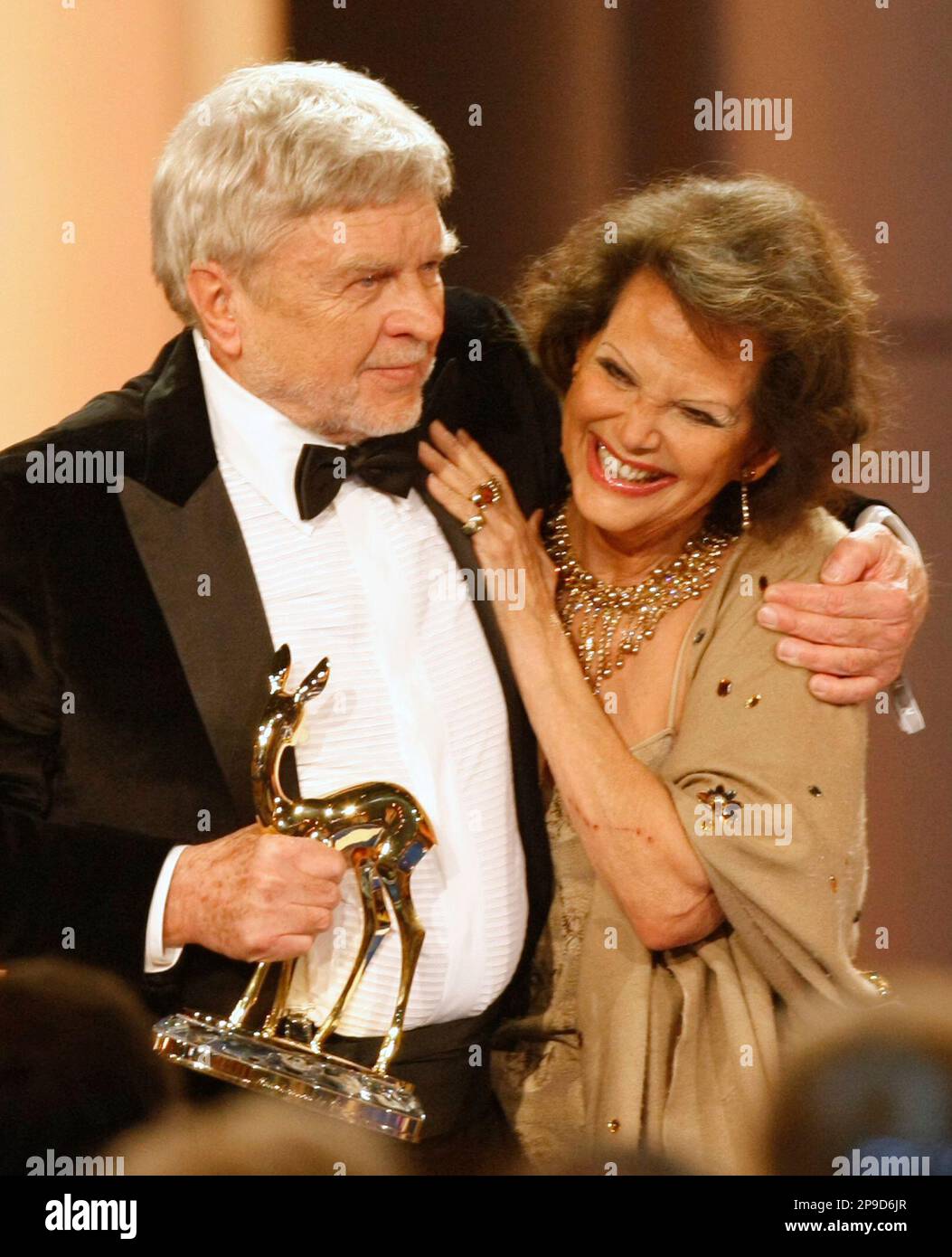 German actor Hardy Krueger, left, receives the prize from Italian ...