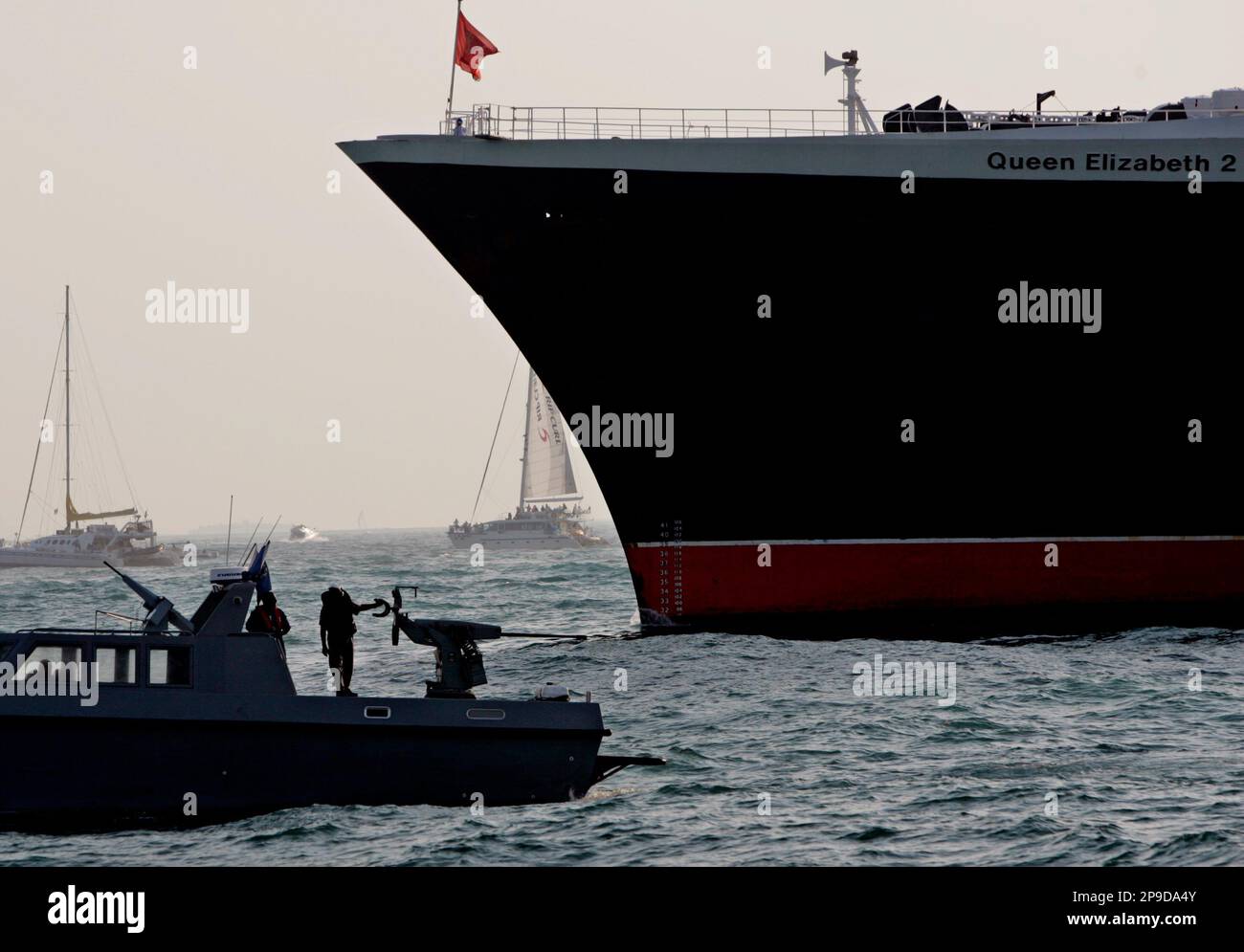 The liner Queen Elizabeth 2 is escorted by the UAE coast guard as she ...